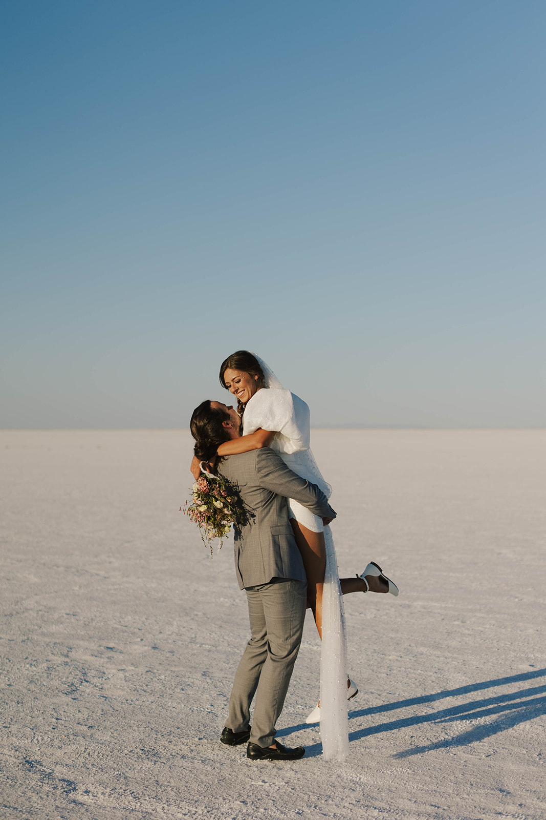 Couple Enjoys Memorable Moments at Bonneville Salt Flats Sunset Elopement